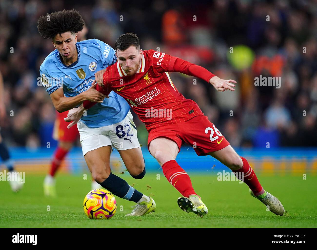 Manchester City's Rico Lewis and Liverpool's Andrew Robertson (right ...