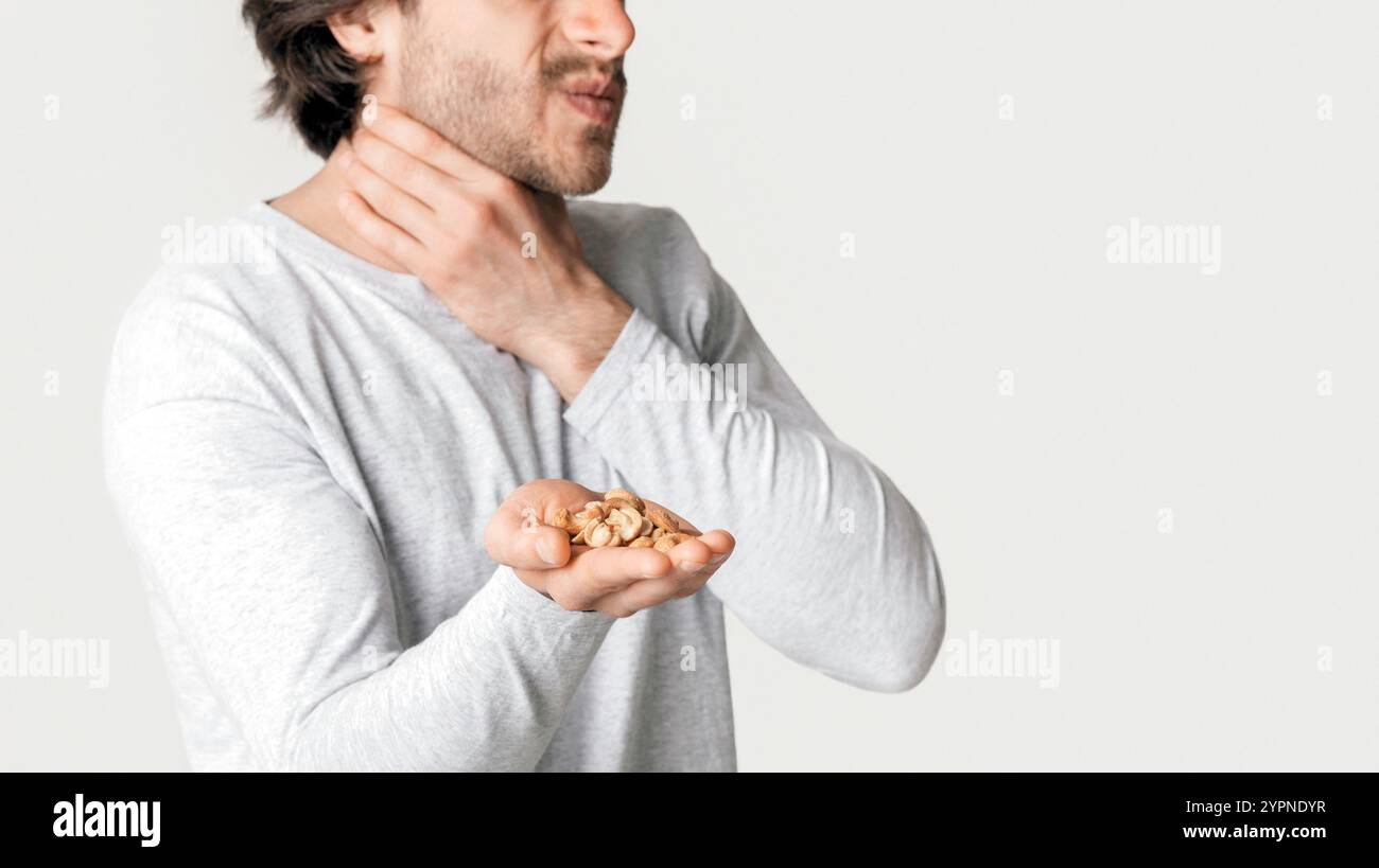 Health problems and food allergies. Man suffocates from nuts Stock ...
