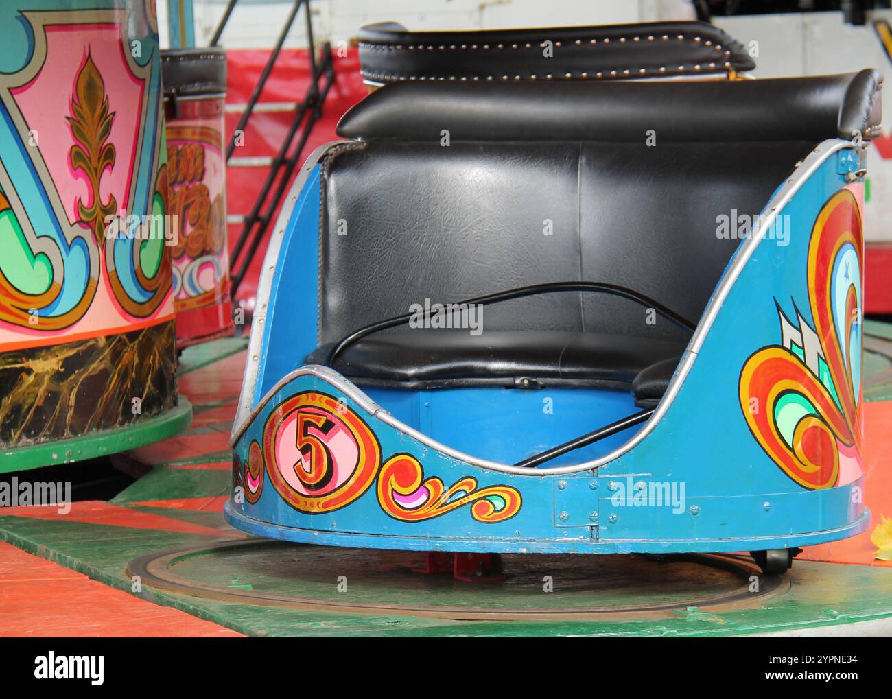 A Seat Carriage on a Fun Fair Waltzer Spinning Ride Stock Photo - Alamy