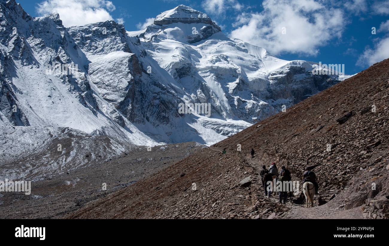 Pilgrims travelling towards Gauri Kund at the base of Adi Kailash ...