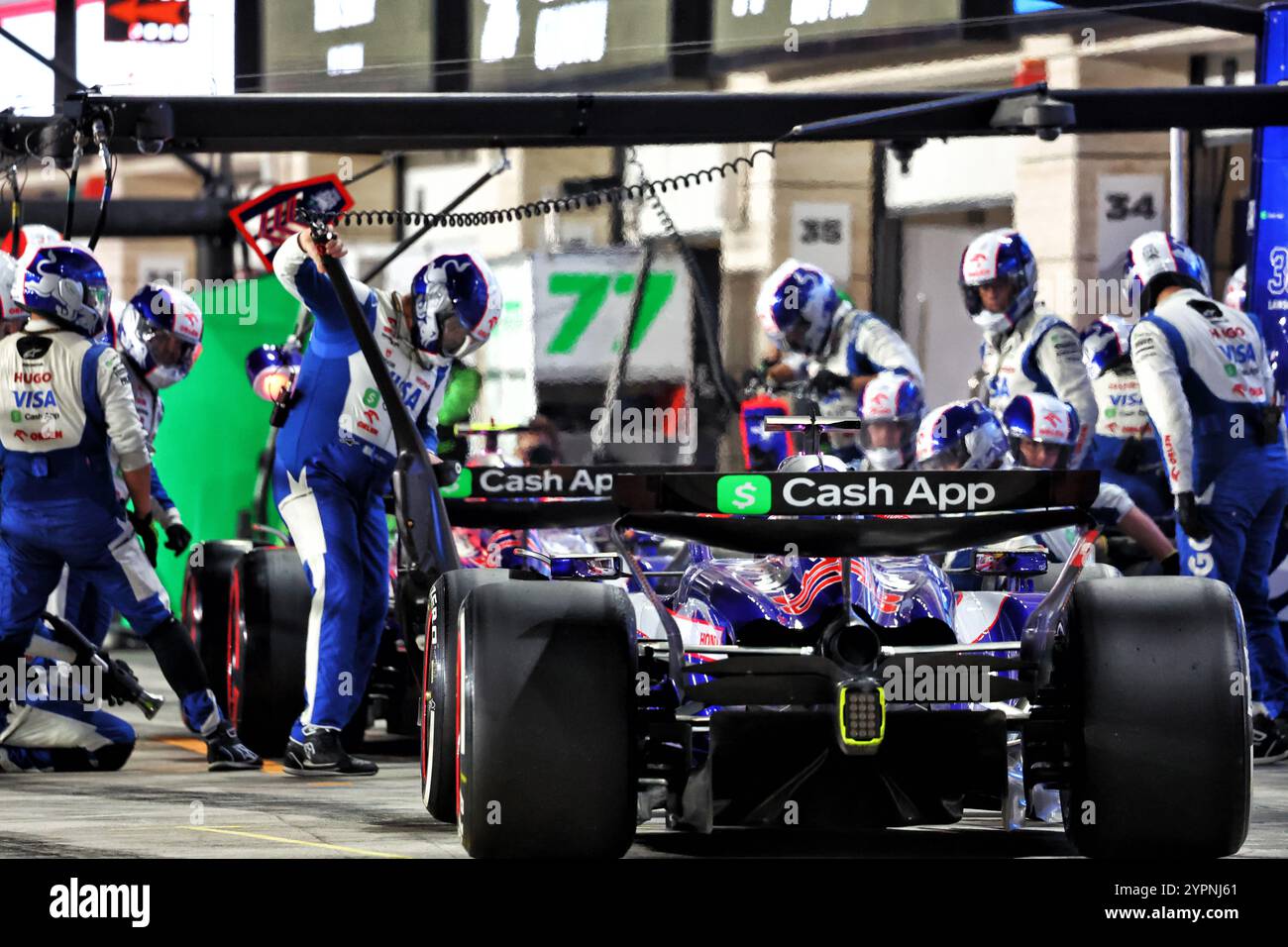 Yuki Tsunoda (JPN) RB VCARB 01 makes a pit stop ahead of team mate Liam ...