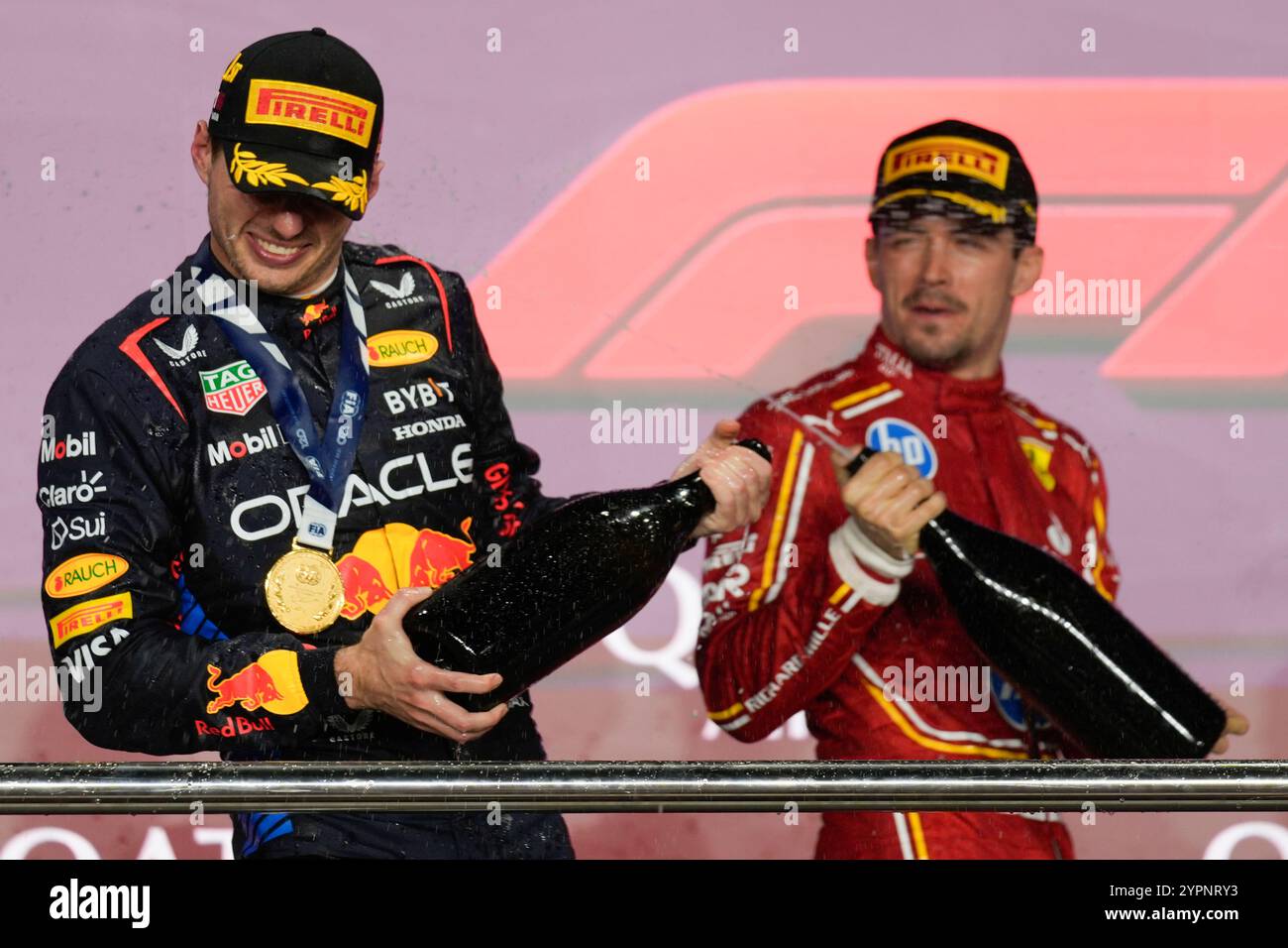 First-placed Red Bull driver Max Verstappen of the Netherlands, left ...