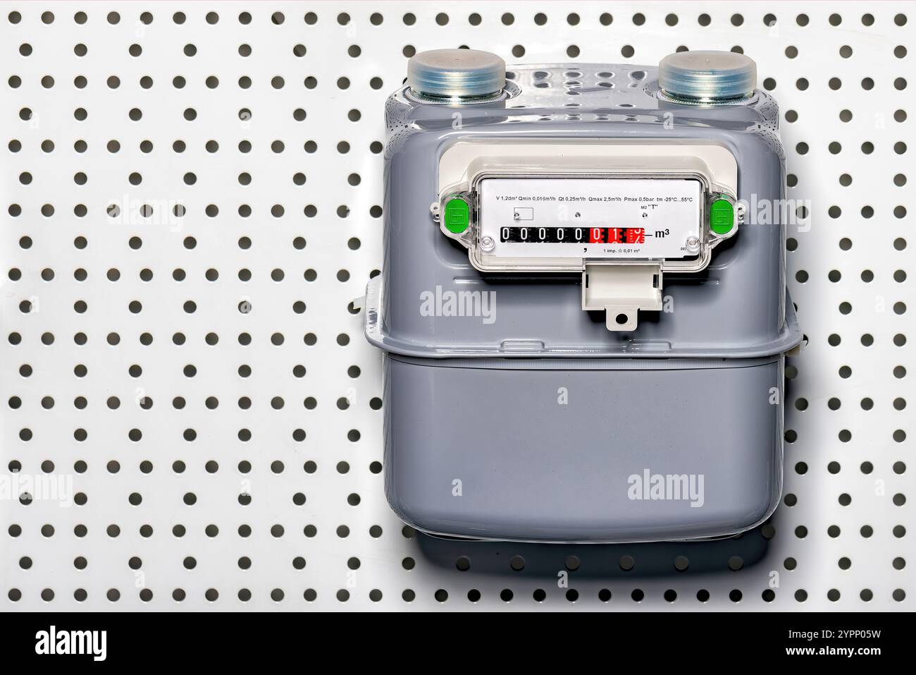 Modern gas meter mounted on a perforated wall showcases efficient ...
