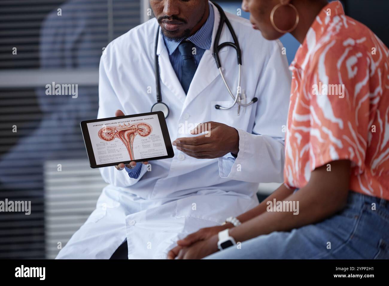 Cropped shot of African American male OBGYN wearing lab coat and ...
