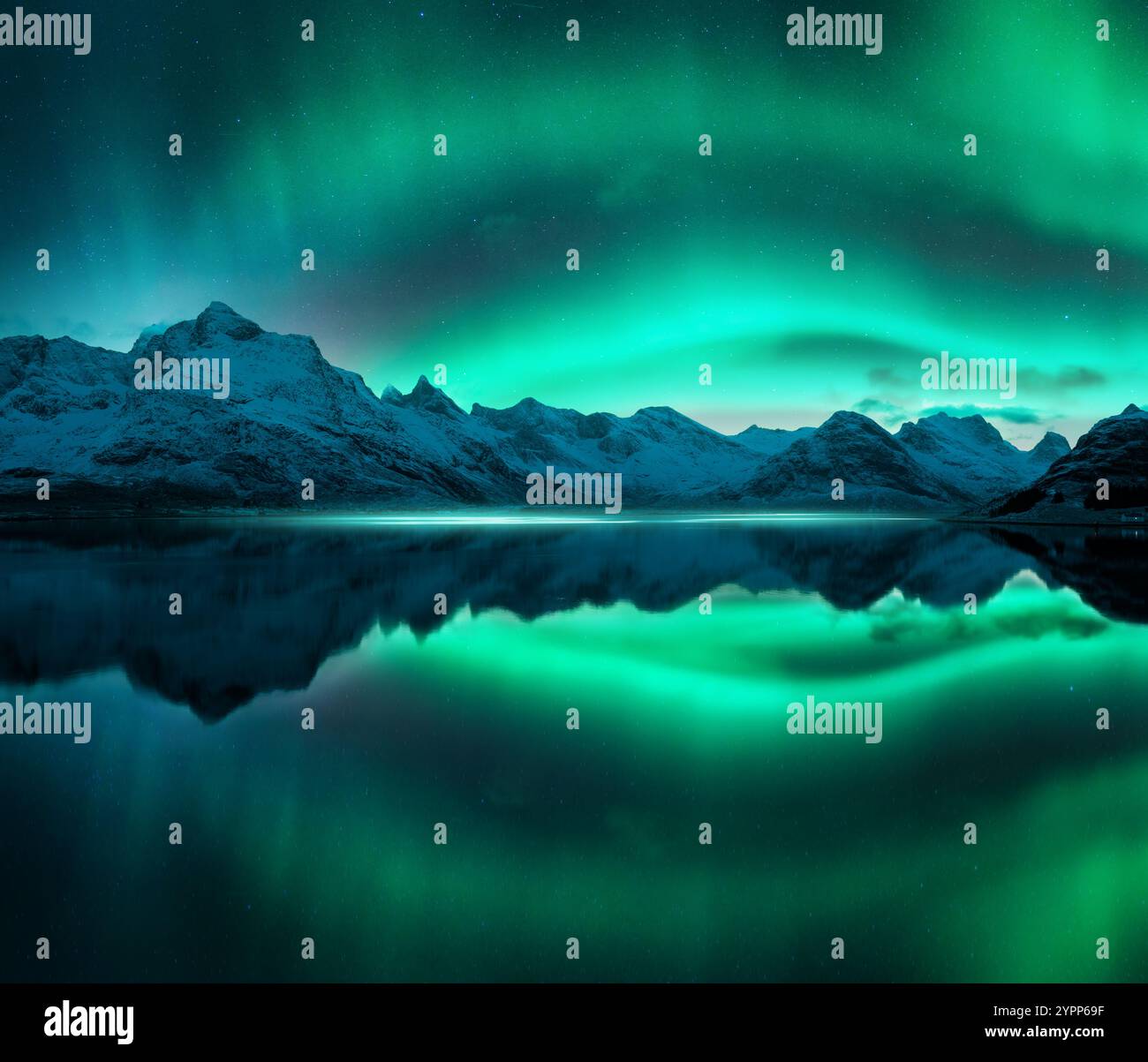Aurora borealis over the snowy mountains, reflection in water Stock ...