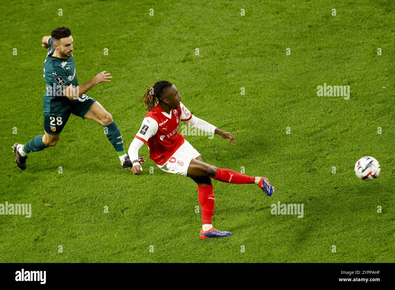 Valentin Atangana Edoa of Reims, left Adrien Thomasson of Lens during ...