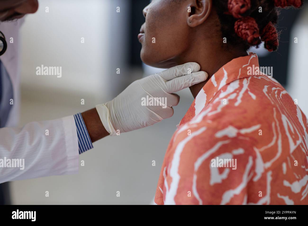 Side view closeup of unrecognizable doctor palpating neck of female ...