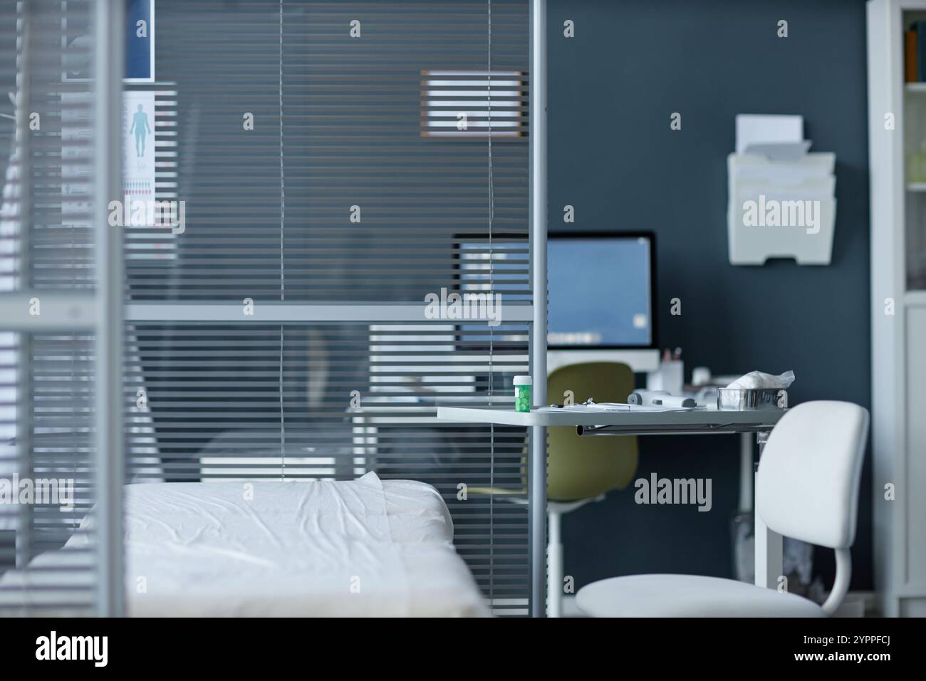 Background image of medical clinic interior with hospital bed, desk and ...