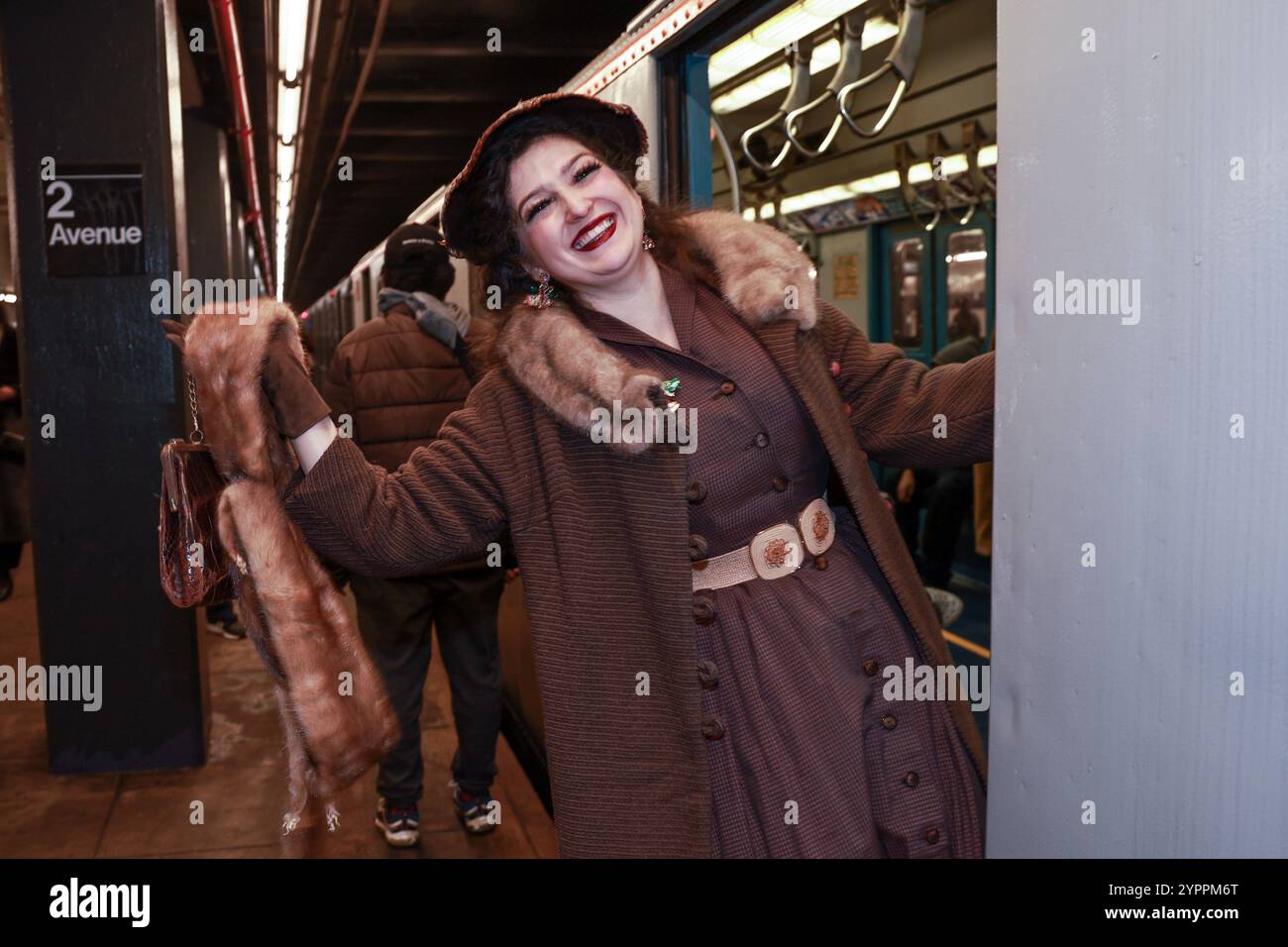 A cosplayer poses for a photo in the Holiday Nostalgia Rides hosted by ...