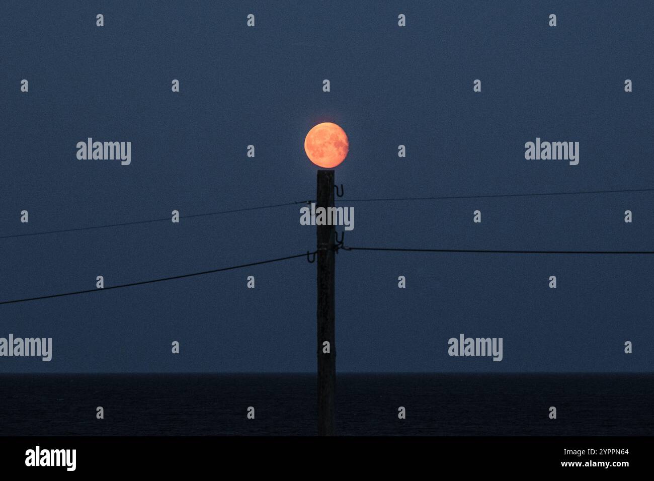 The night moon on top of a power line pole Stock Photo - Alamy