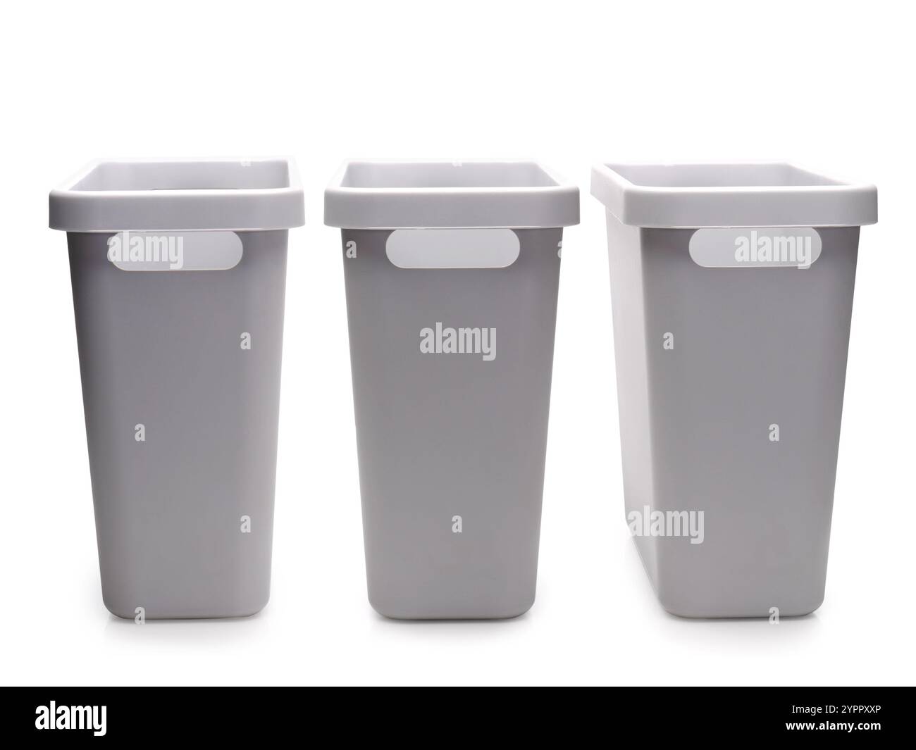 Three gray plastic trash bins over white background Stock Photo - Alamy