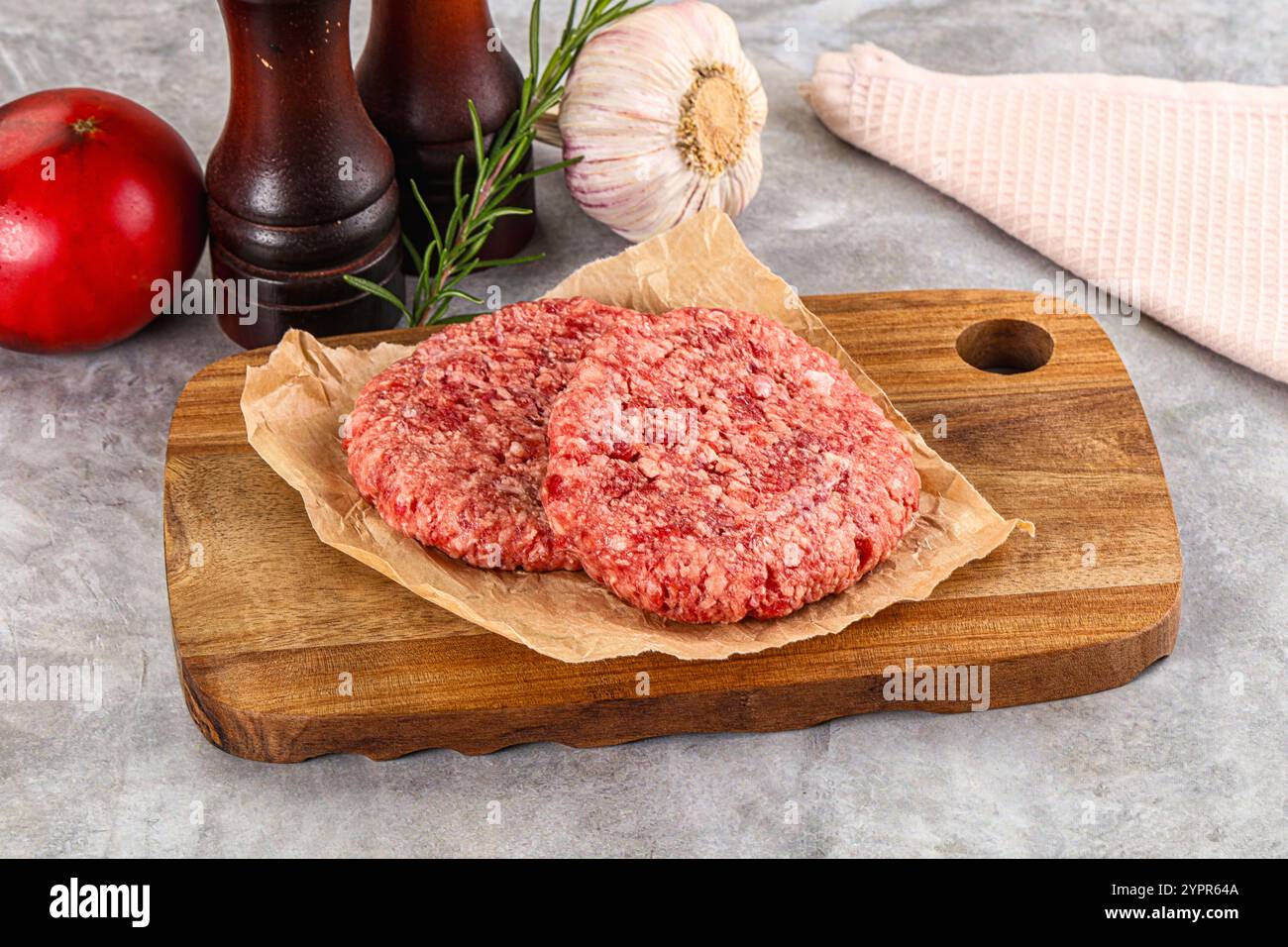 Raw round uncooked beef cutlet minced meat Stock Photo - Alamy