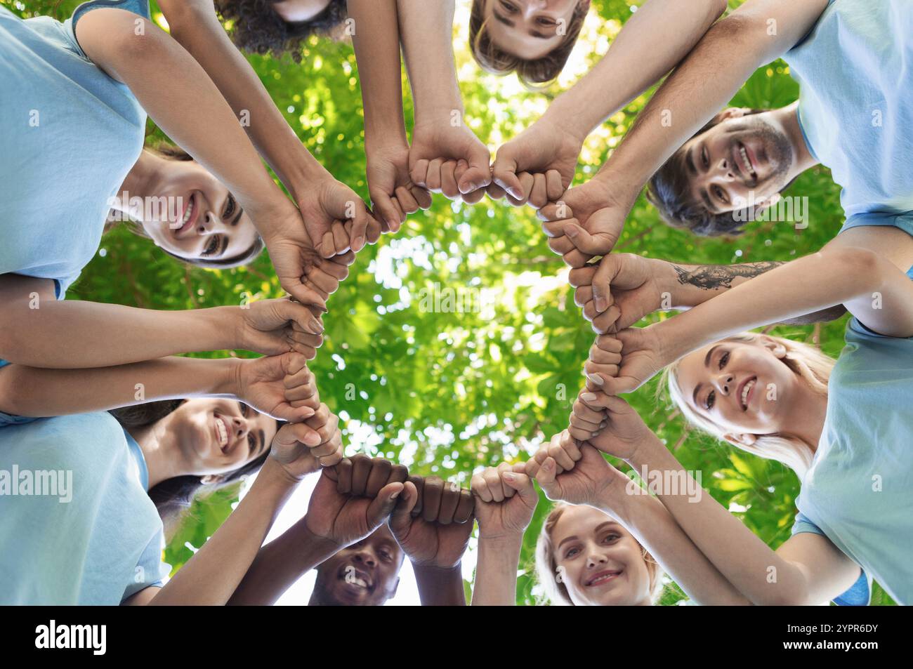 Group of people fist bump assemble together Stock Photo - Alamy