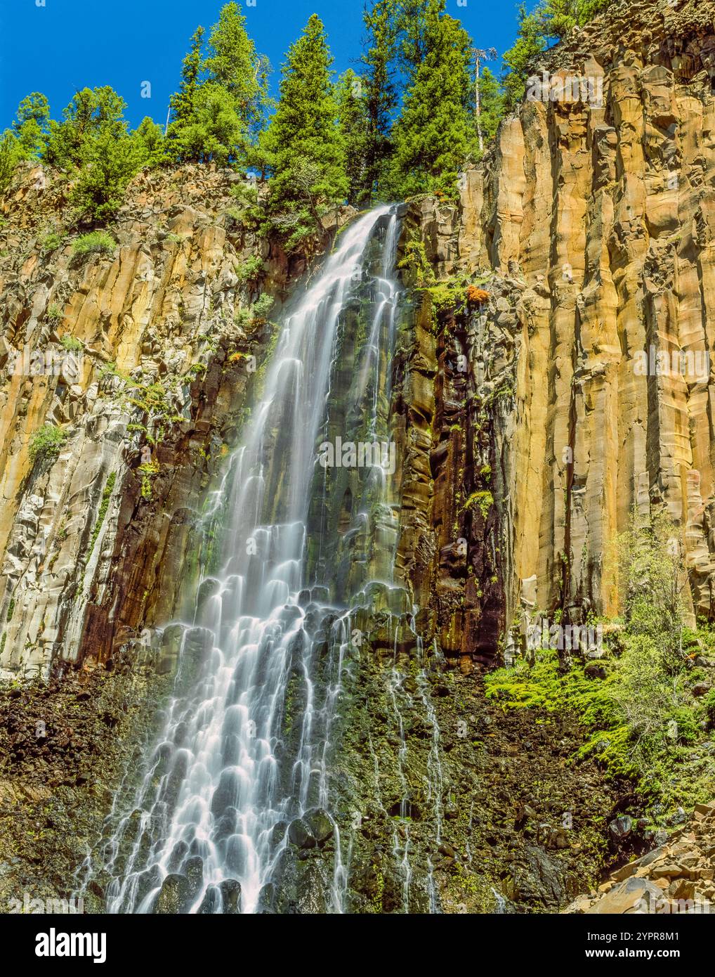 palisade falls spilling over columnar basalt in the east fork hyalite ...