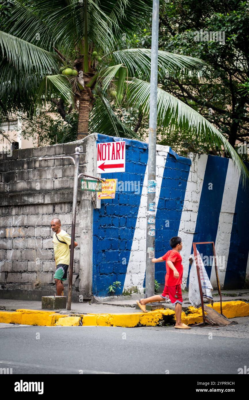 Pedestrians make their way along an interesting junction with a painted ...