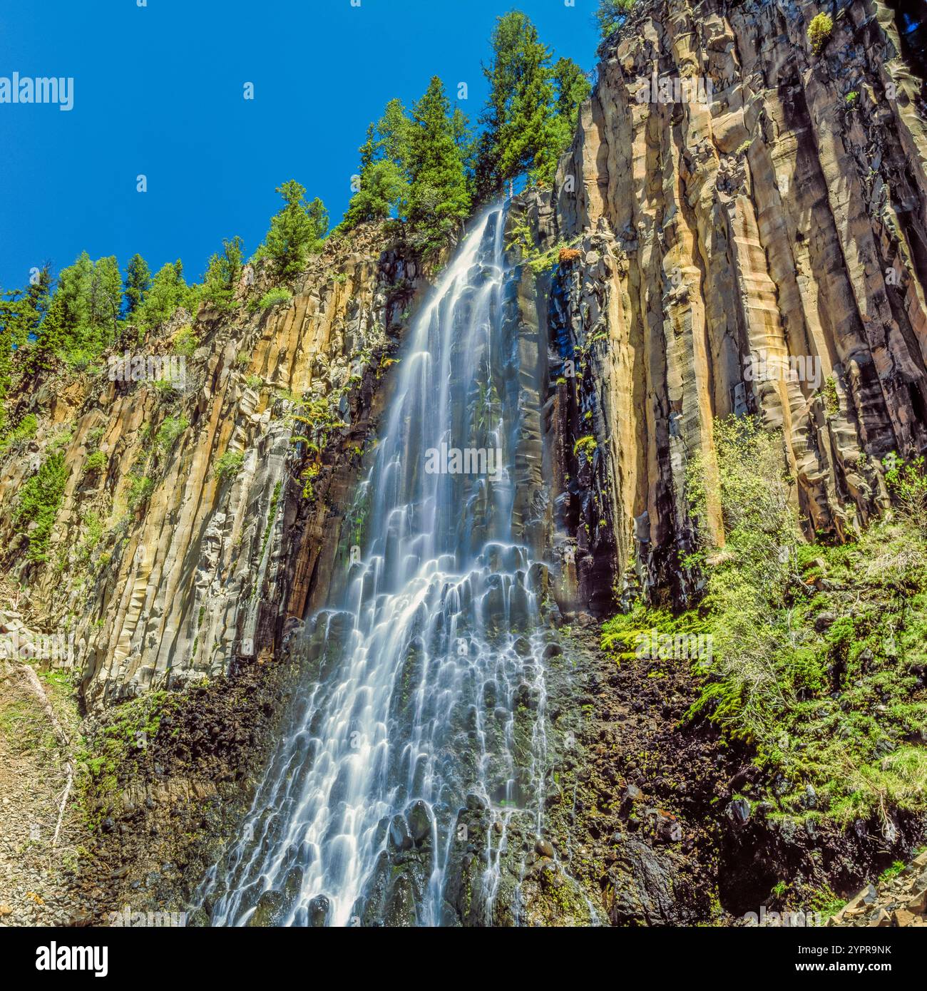 palisade falls spilling over columnar basalt in the east fork hyalite ...