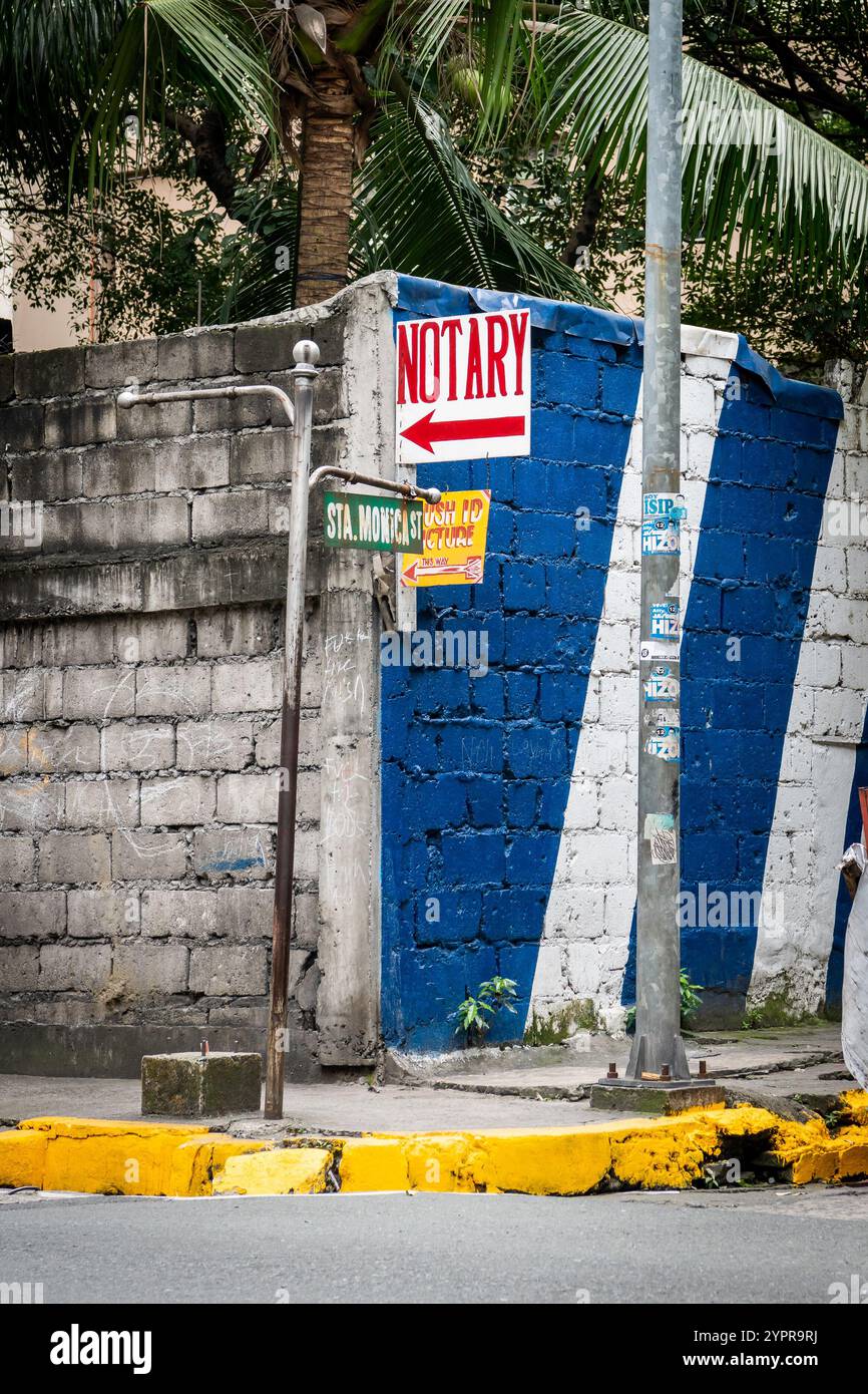 An interesting junction with a painted wall in the Ermita District of ...