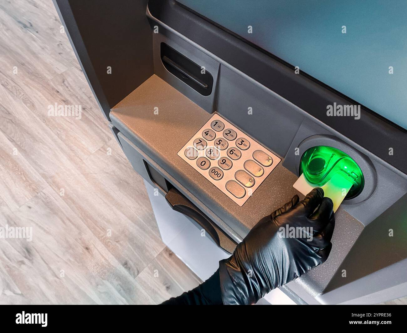 Thief hand with black glove stealing money. Burglar committing robbery ...