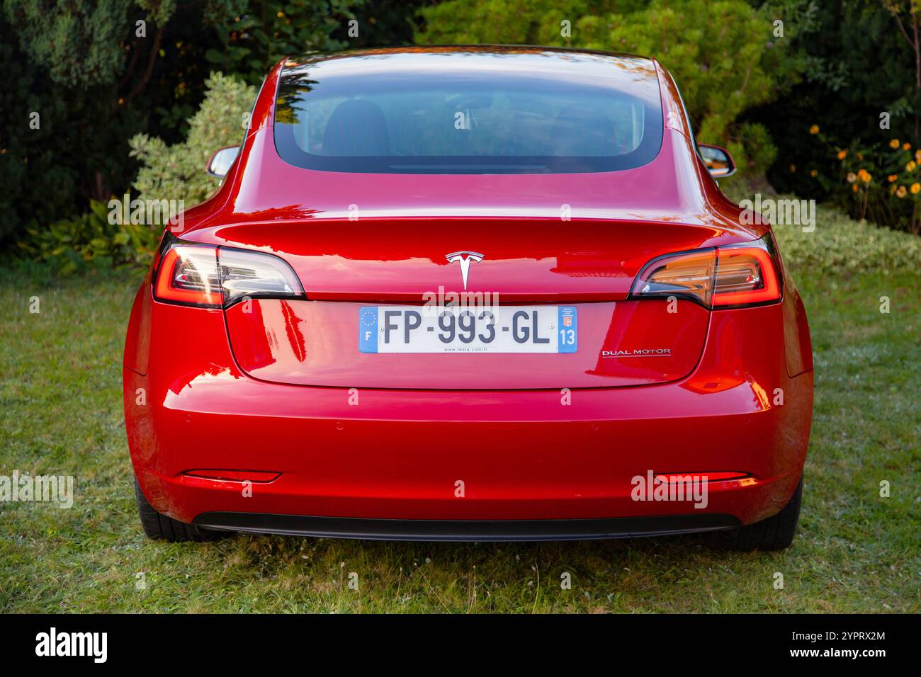 Vilnius, Lithuania - 15-08-2024 - Red Tesla Model 3 Dual motor rear ...