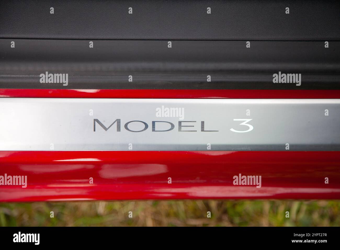Vilnius, Lithuania - 16-08-2024 - Tesla Model 3 car threshold with name ...