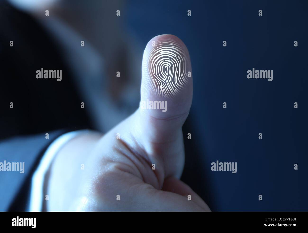 Woman pressing finger to surface showing friction ridges pattern ...