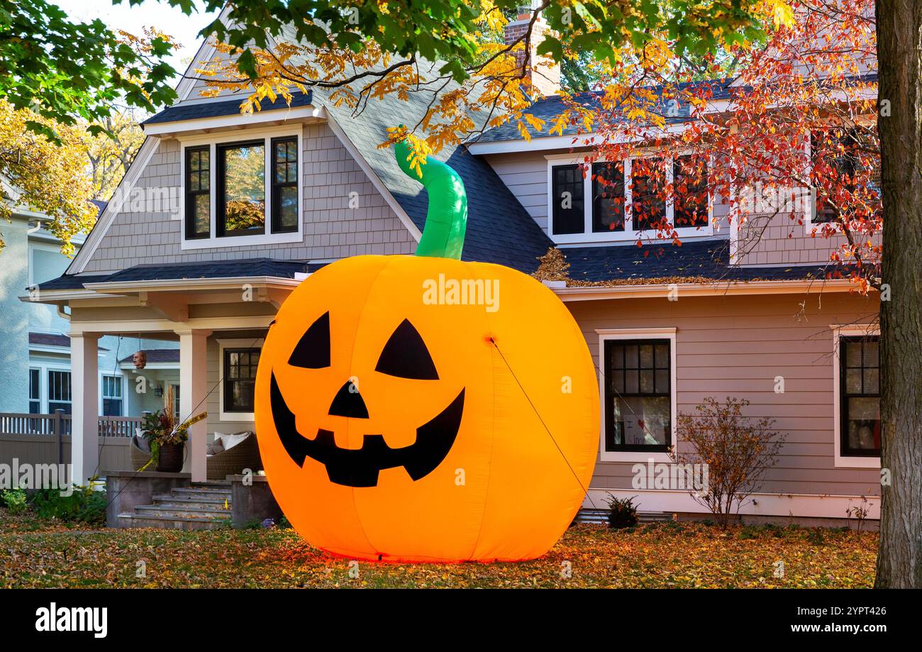 A huge bright orange inflatable Jack-o’-Lantern pumpkin decoration for ...