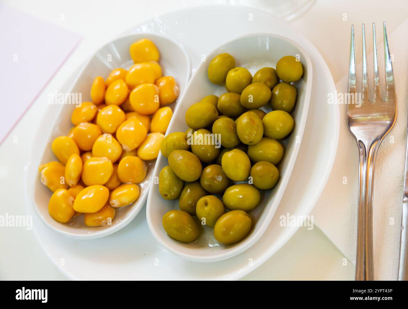 Green unpitted olives and pickled lupin beans Stock Photo - Alamy