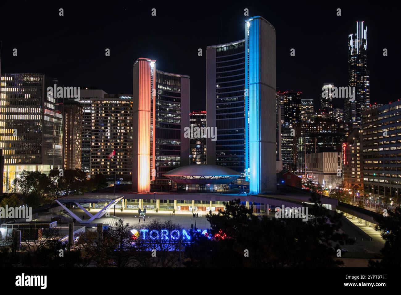 Changing color lights on city hall twin towers at night on Queen Street ...