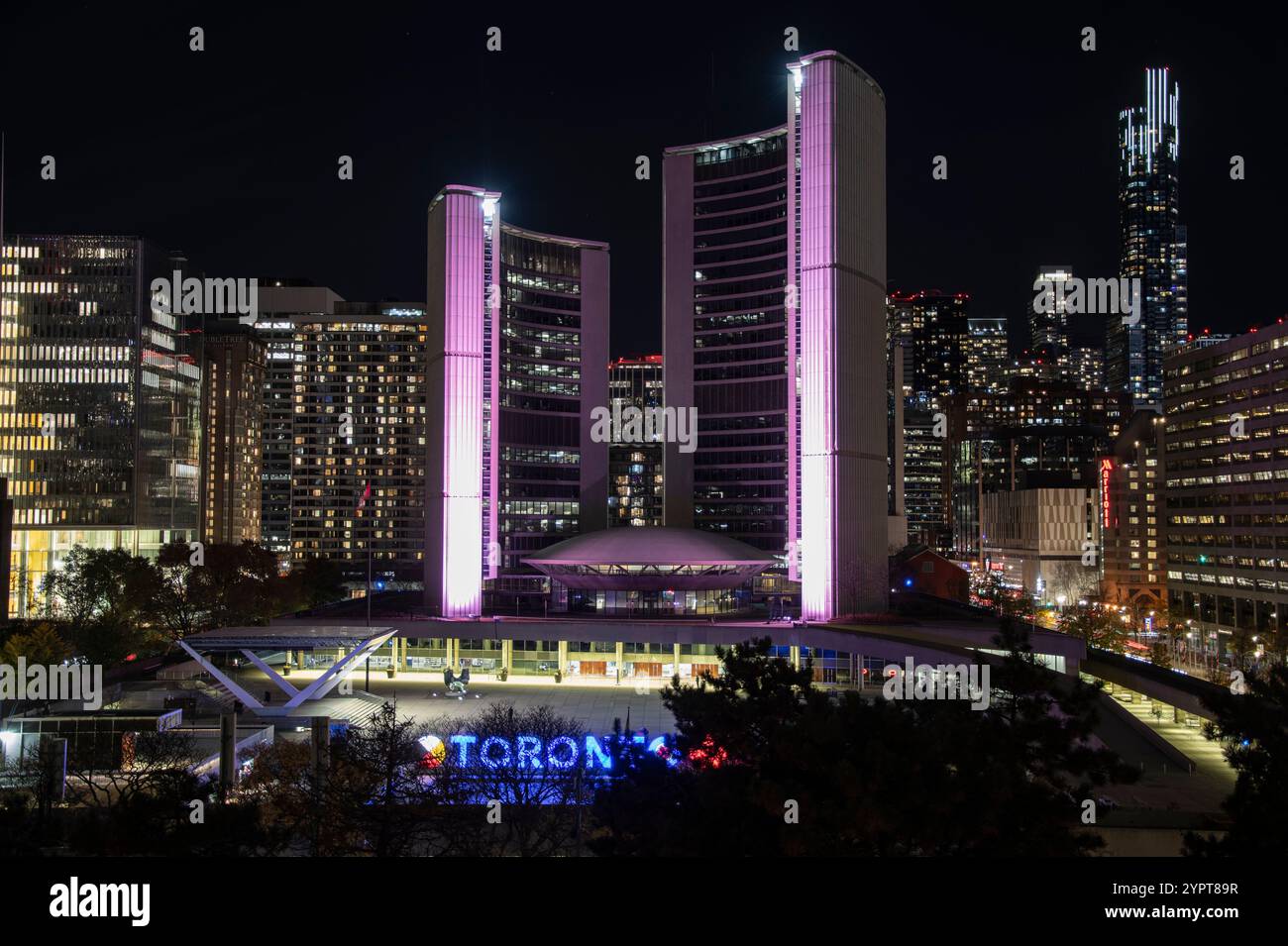 Changing color lights on city hall twin towers at night on Queen Street ...