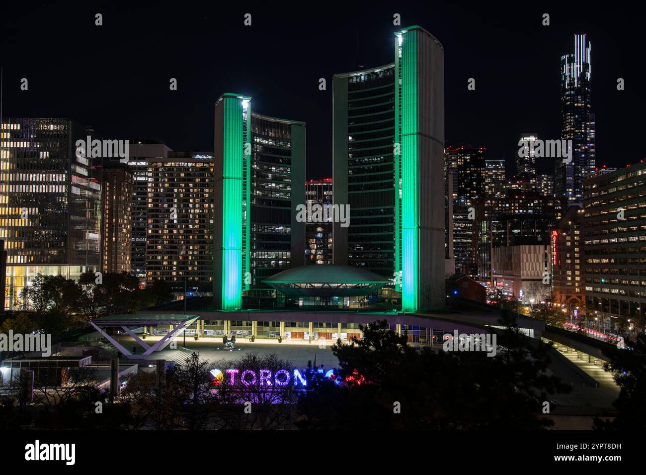Changing color lights on city hall twin towers at night on Queen Street ...
