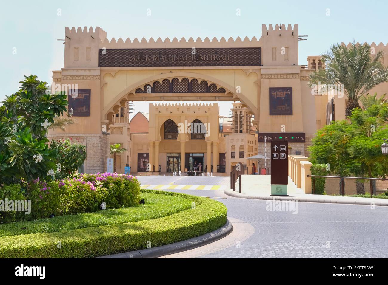 Empty landscaped entry into luxury resort area with entrance with ...