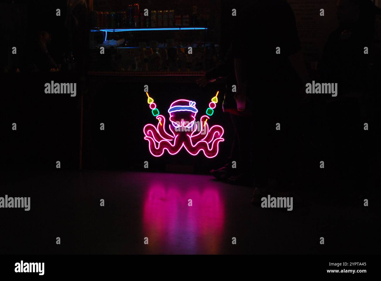 A Neon Octopus Sign Elegantly Illuminating the Vibrant Atmosphere of a ...