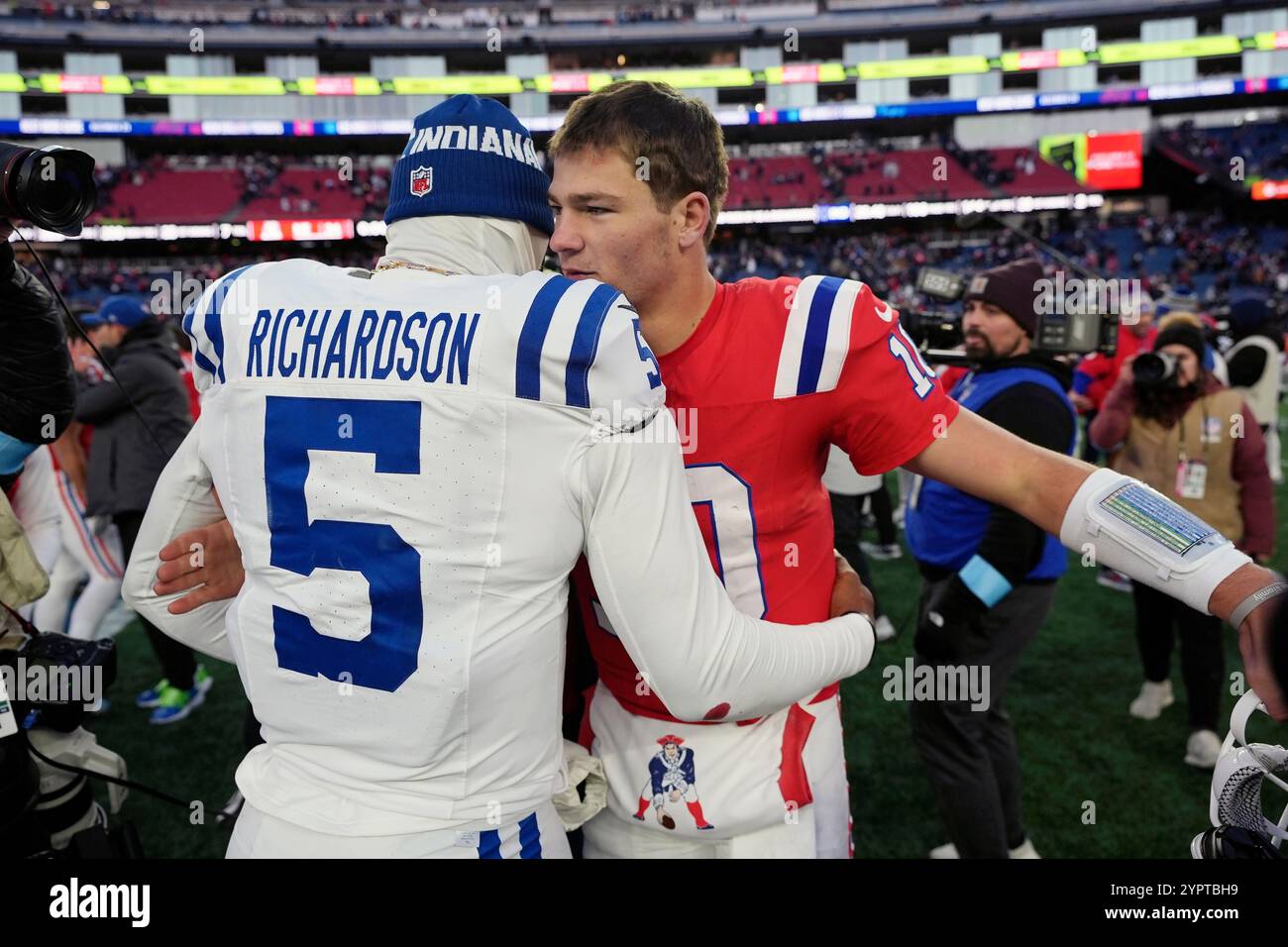 New England Patriots quarterback Drake Maye (10) hugs Indianapolis ...