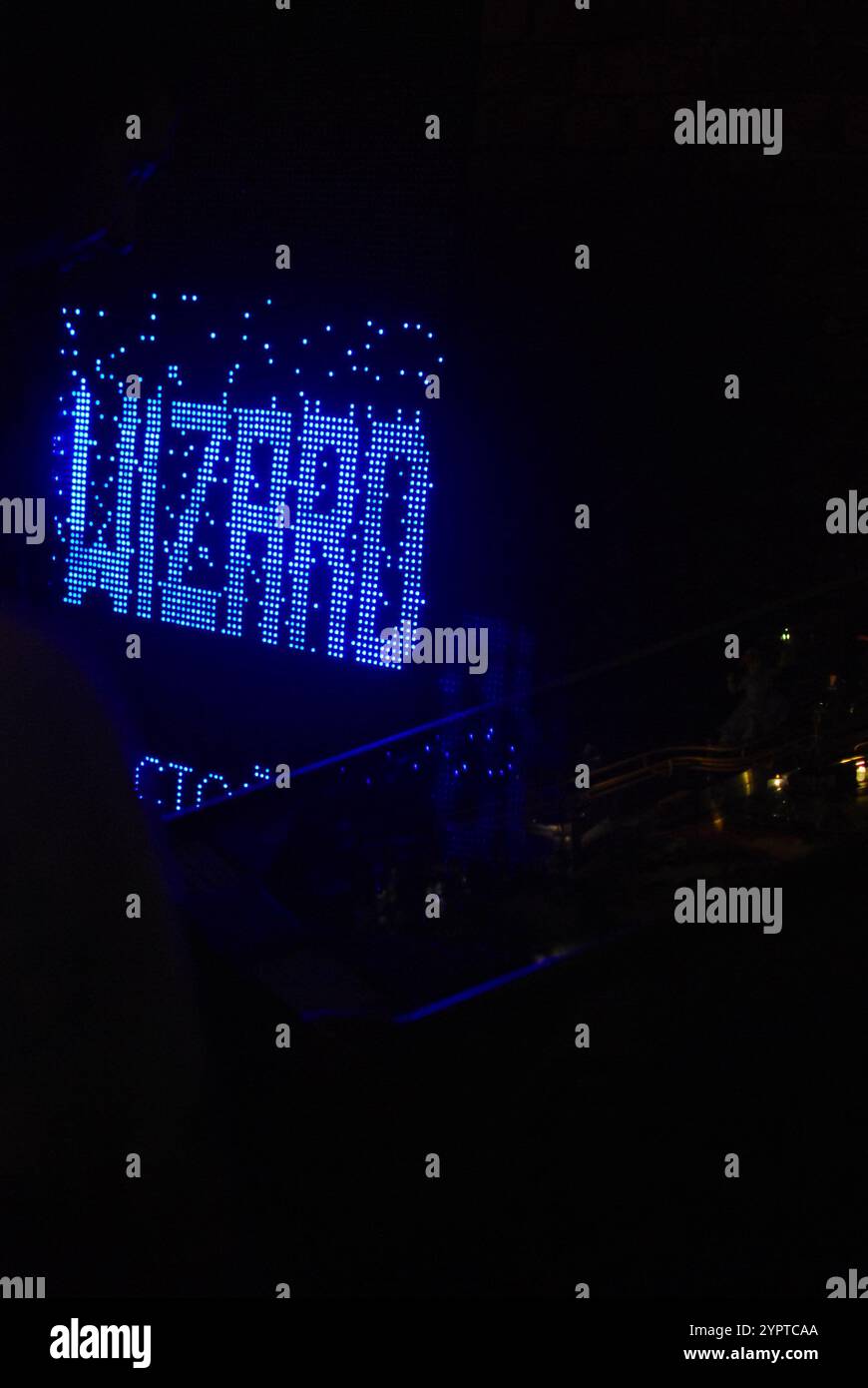 An illuminated wizard sign creates a magical atmosphere in the ...