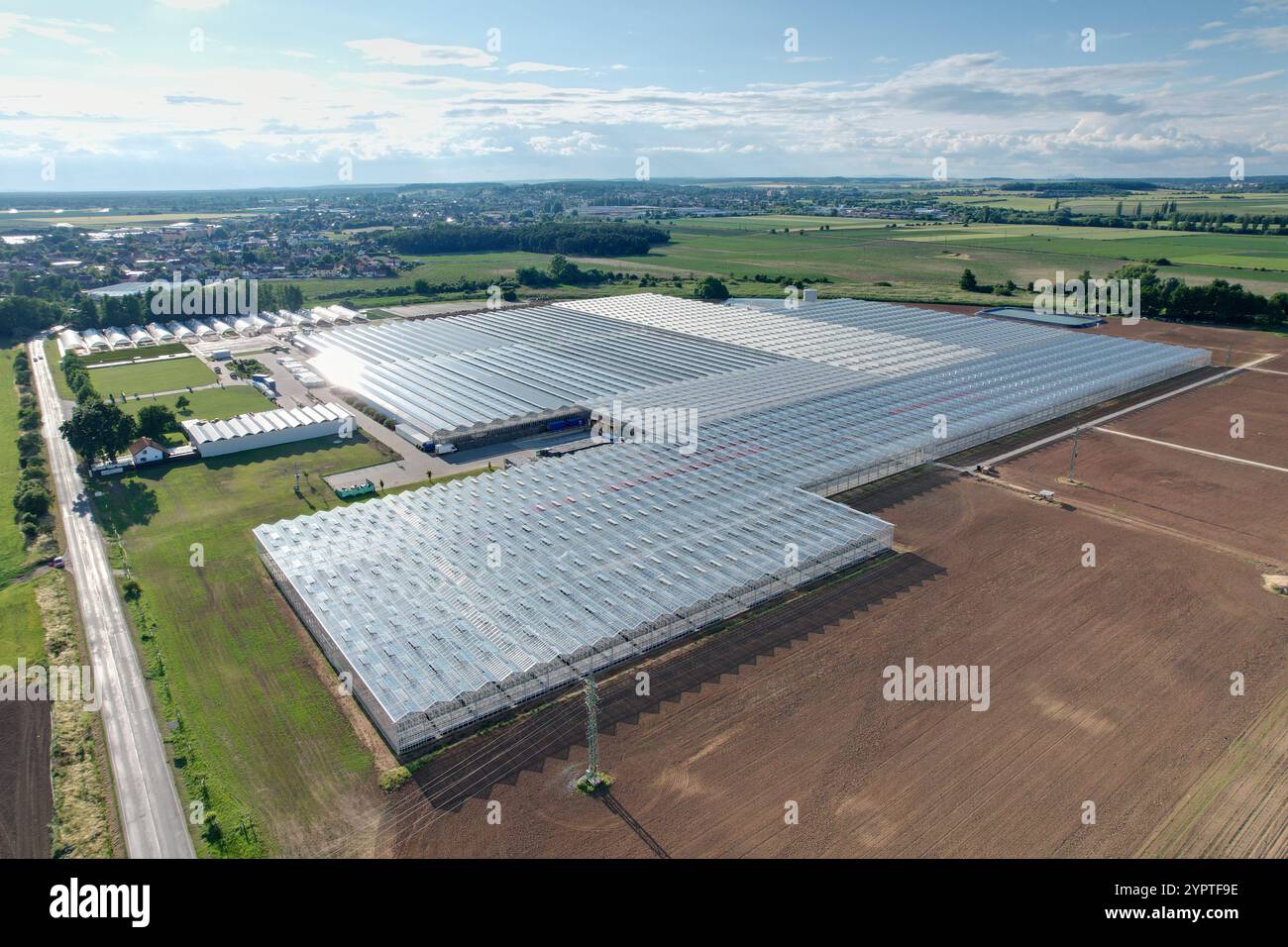 Glass greenhouses from above in sunny weather, big glass houses from ...