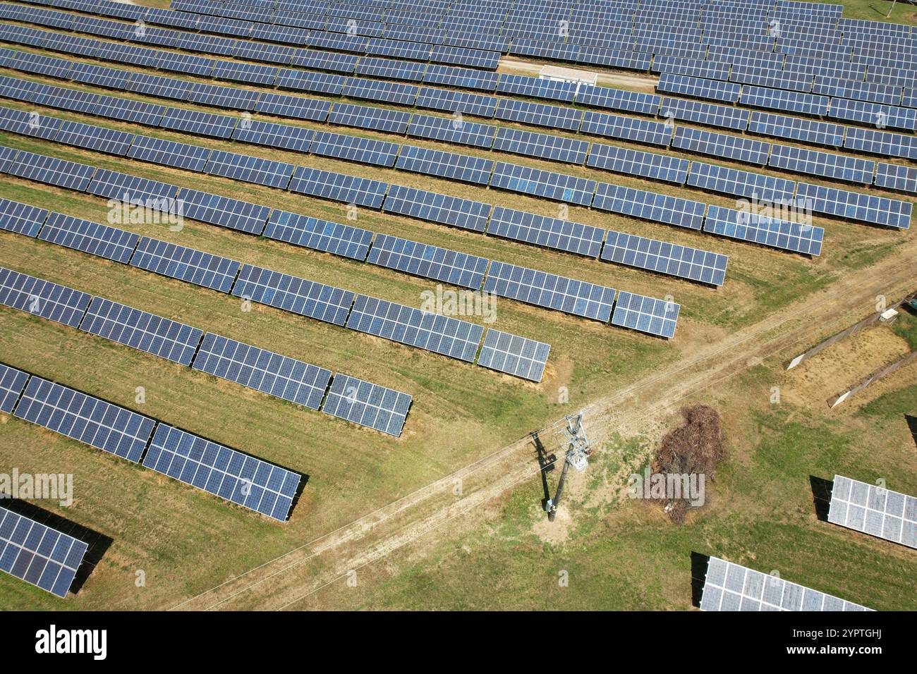 Aerial photo of solar power plant. Many solar energy panels in countryside from above ...
