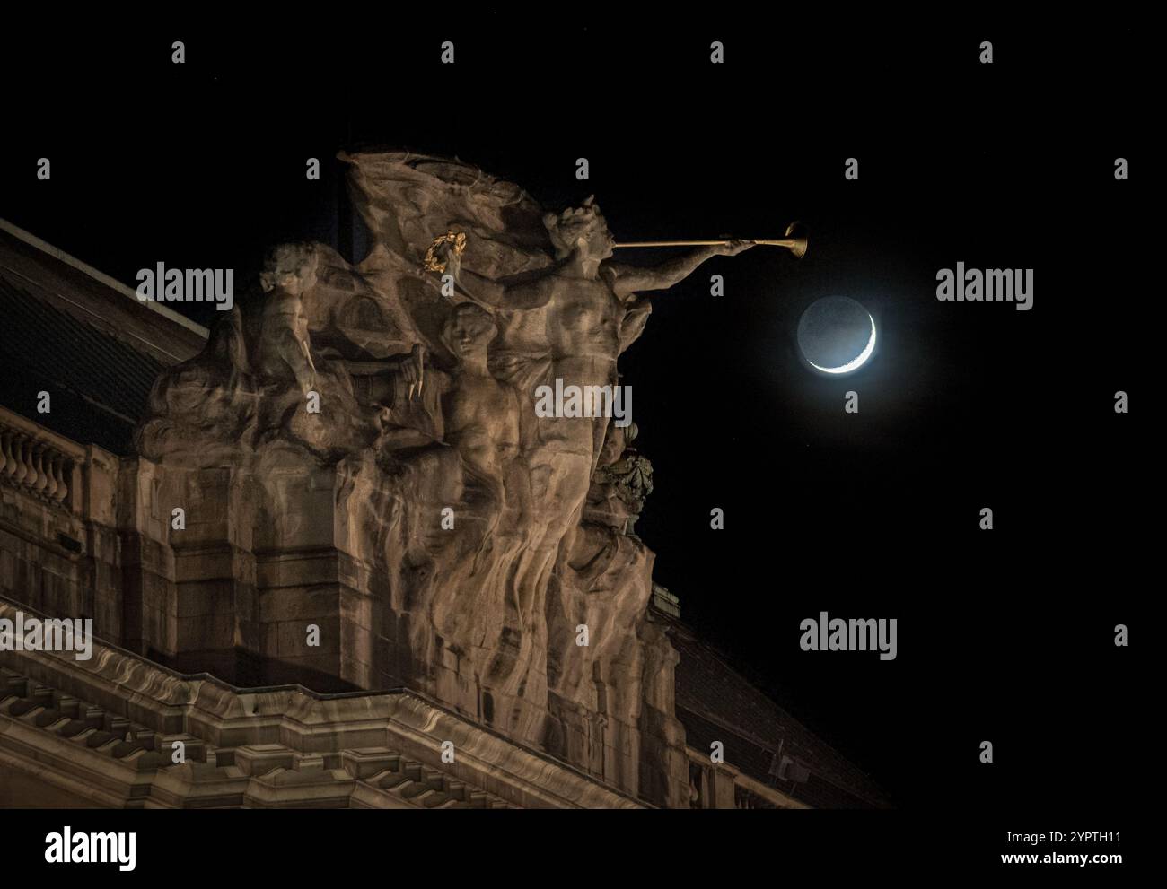 Sculpture of an angel with a trumpet and a crescent moon Stock Photo ...