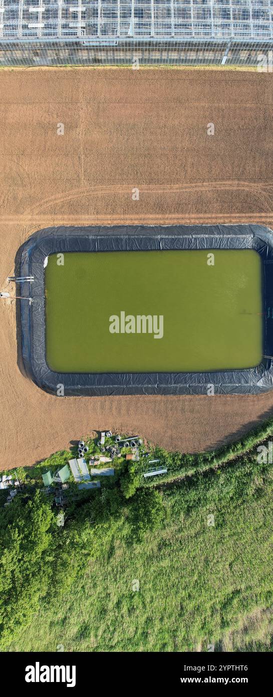 Glass greenhouses from above in sunny weather, big glass houses from ...