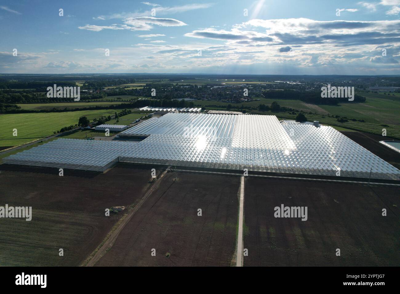 Glass greenhouses from above in sunny weather, big glass houses from ...