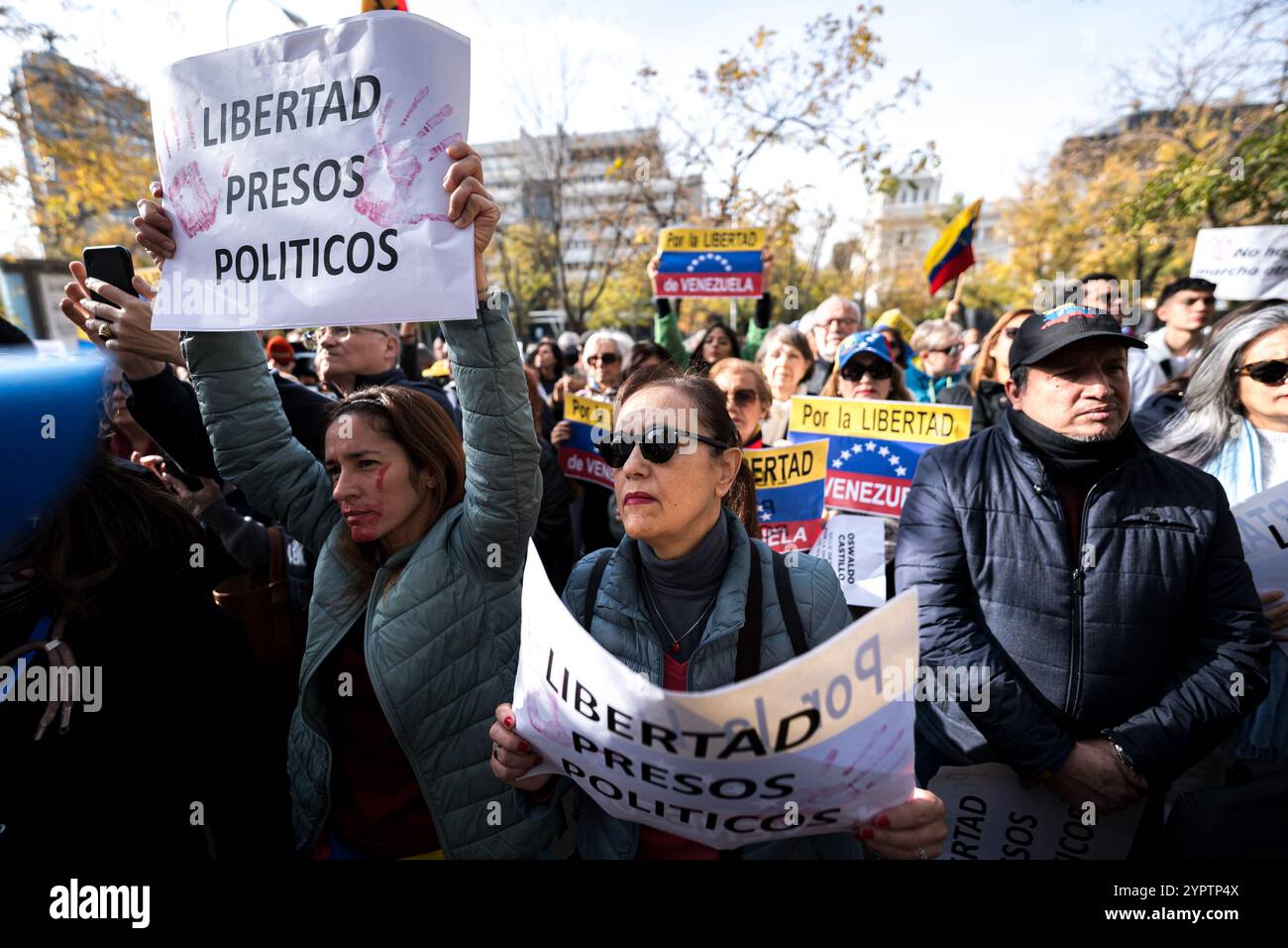 Protesters hold placards expressing their opinion during the ...
