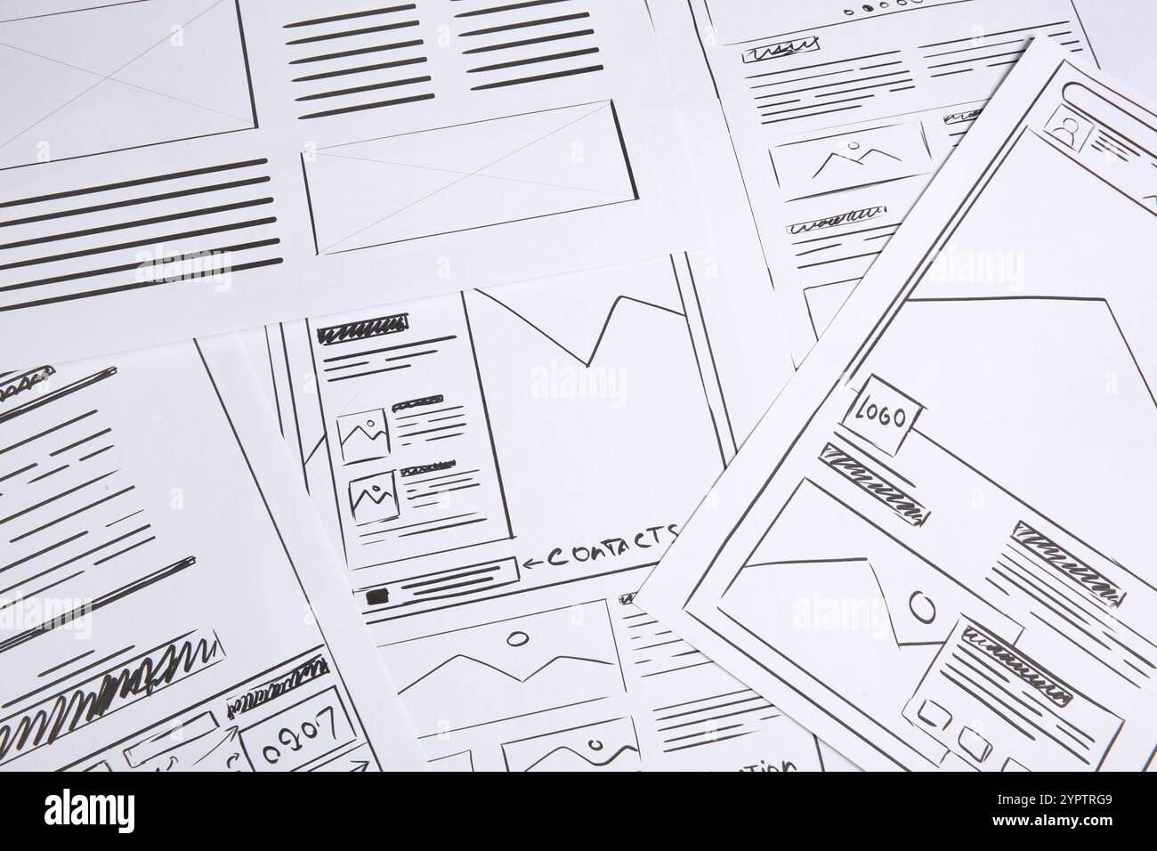 Developing UI design. Sketches of website wireframes as background ...