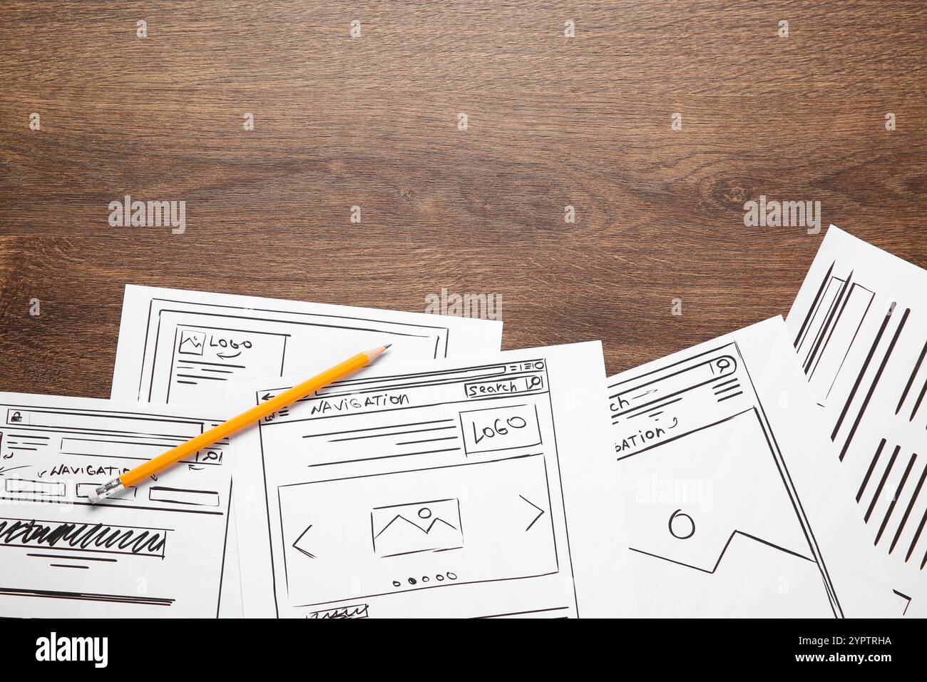 Developing UI design. Sketches of website wireframes and pencil on ...
