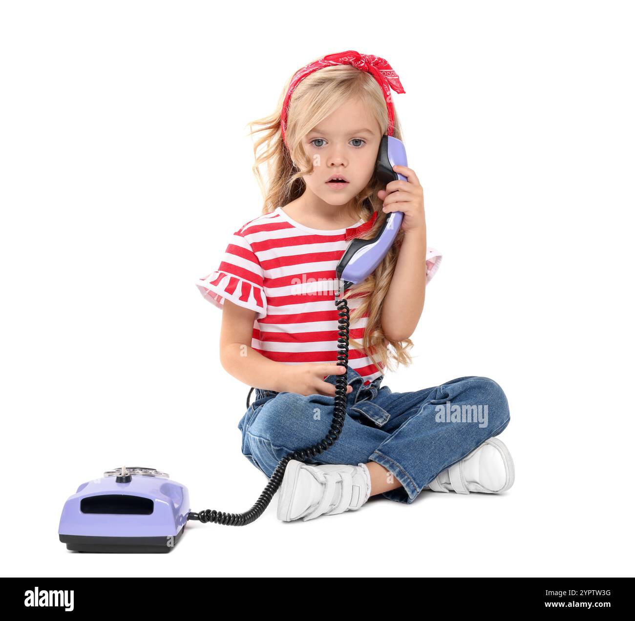 Cute little girl with telephone on white background Stock Photo - Alamy