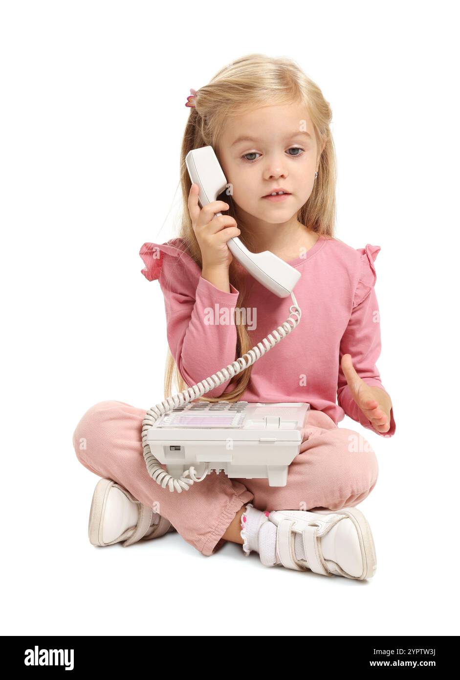 Cute little girl with telephone on white background Stock Photo - Alamy