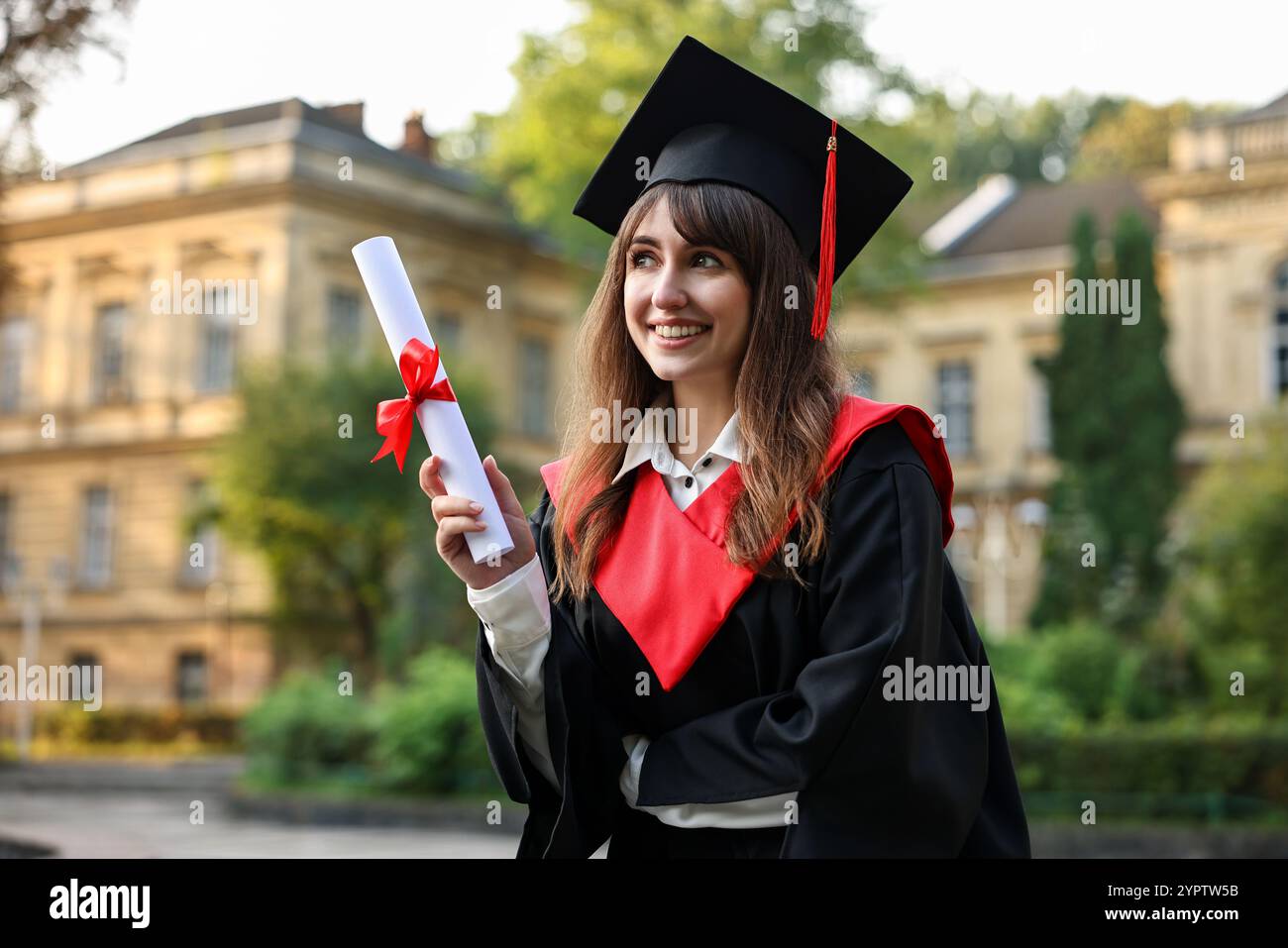 Happy student with diploma after graduation ceremony outdoors Stock ...
