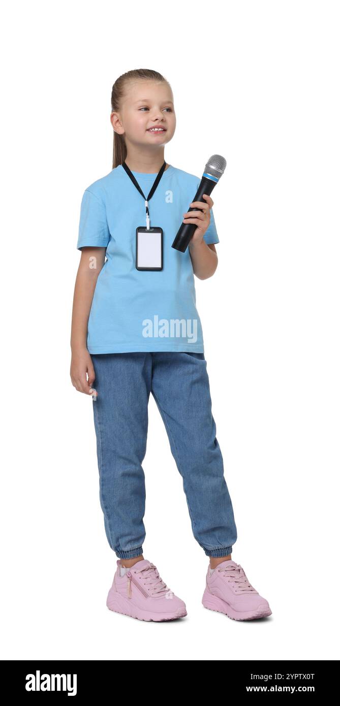 Little girl with microphone pretending to be journalist on white ...