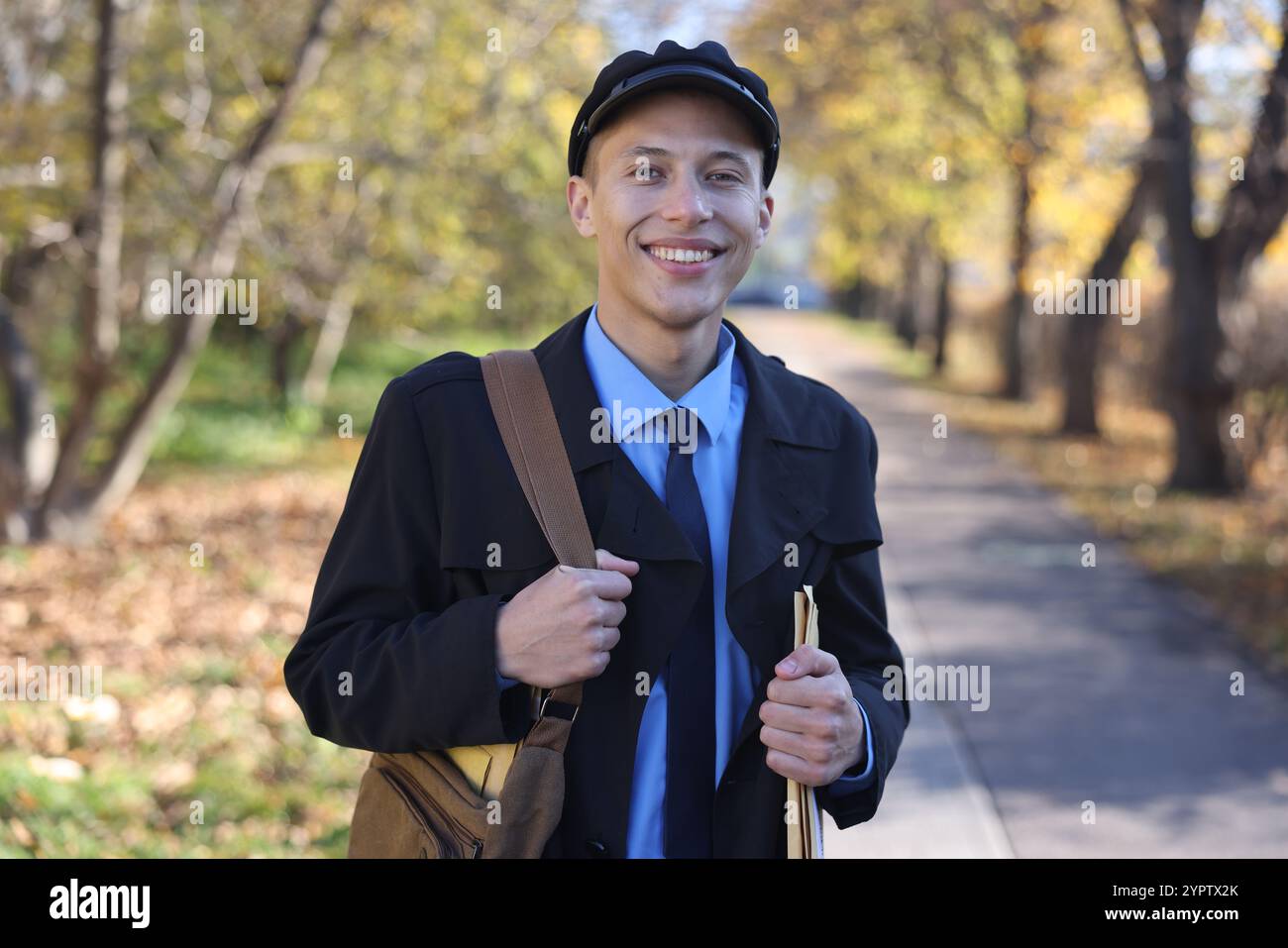 Happy postman in uniform hi-res stock photography and images - Alamy