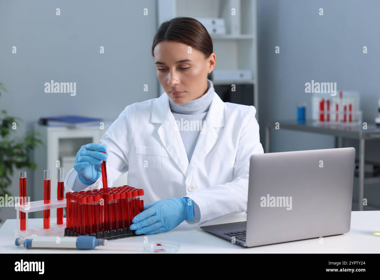 Scientist taking sample micropipette hi-res stock photography and ...