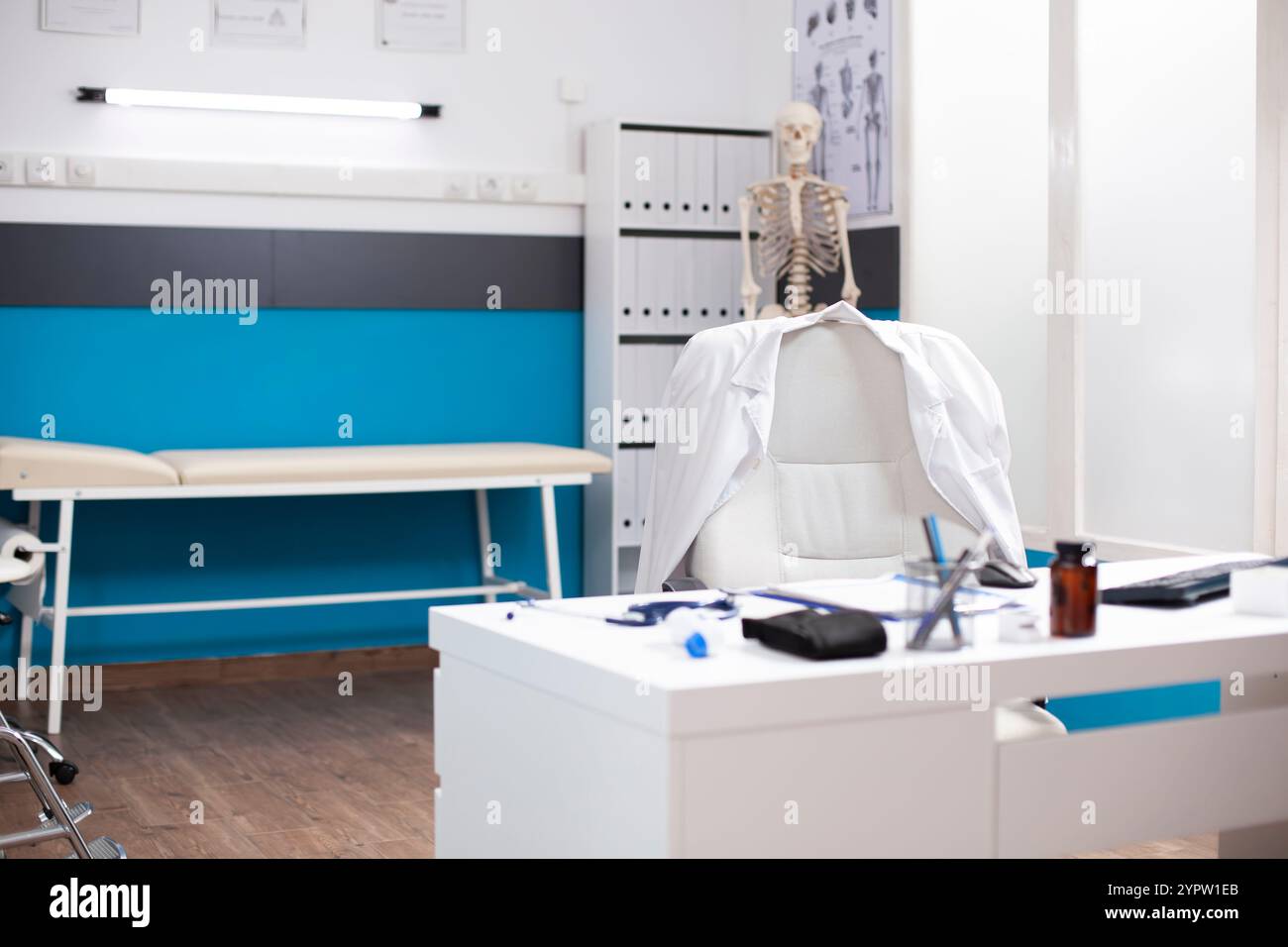 Small clinic is set-up with hospital equipment such as examination bed ...