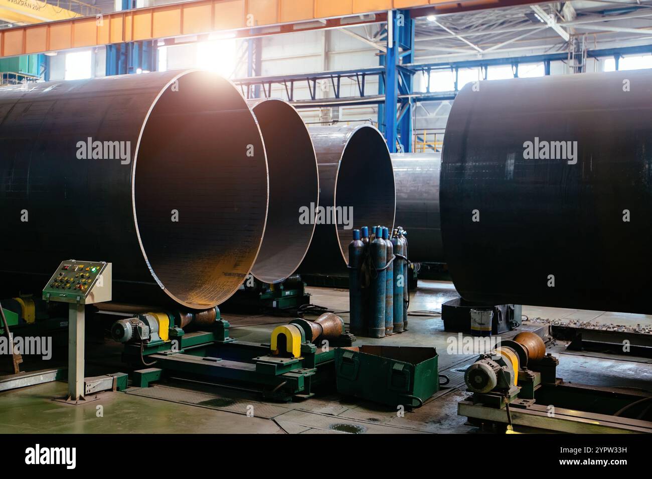 Modern seam pipe factory production line. New manufactured pipes on ...